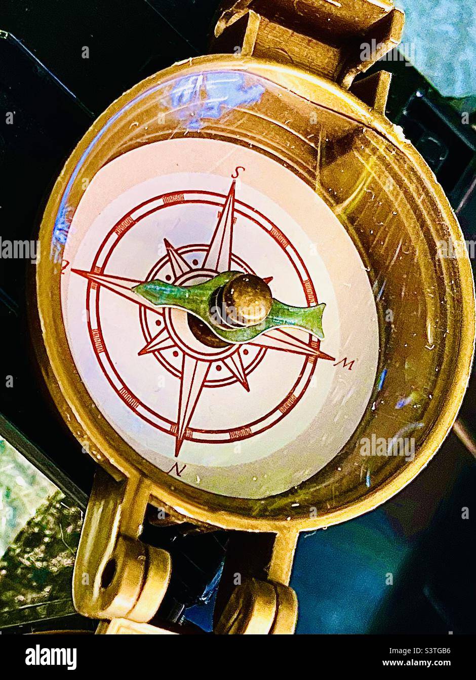 Closeup of children’s compass pointing East Stock Photo - Alamy