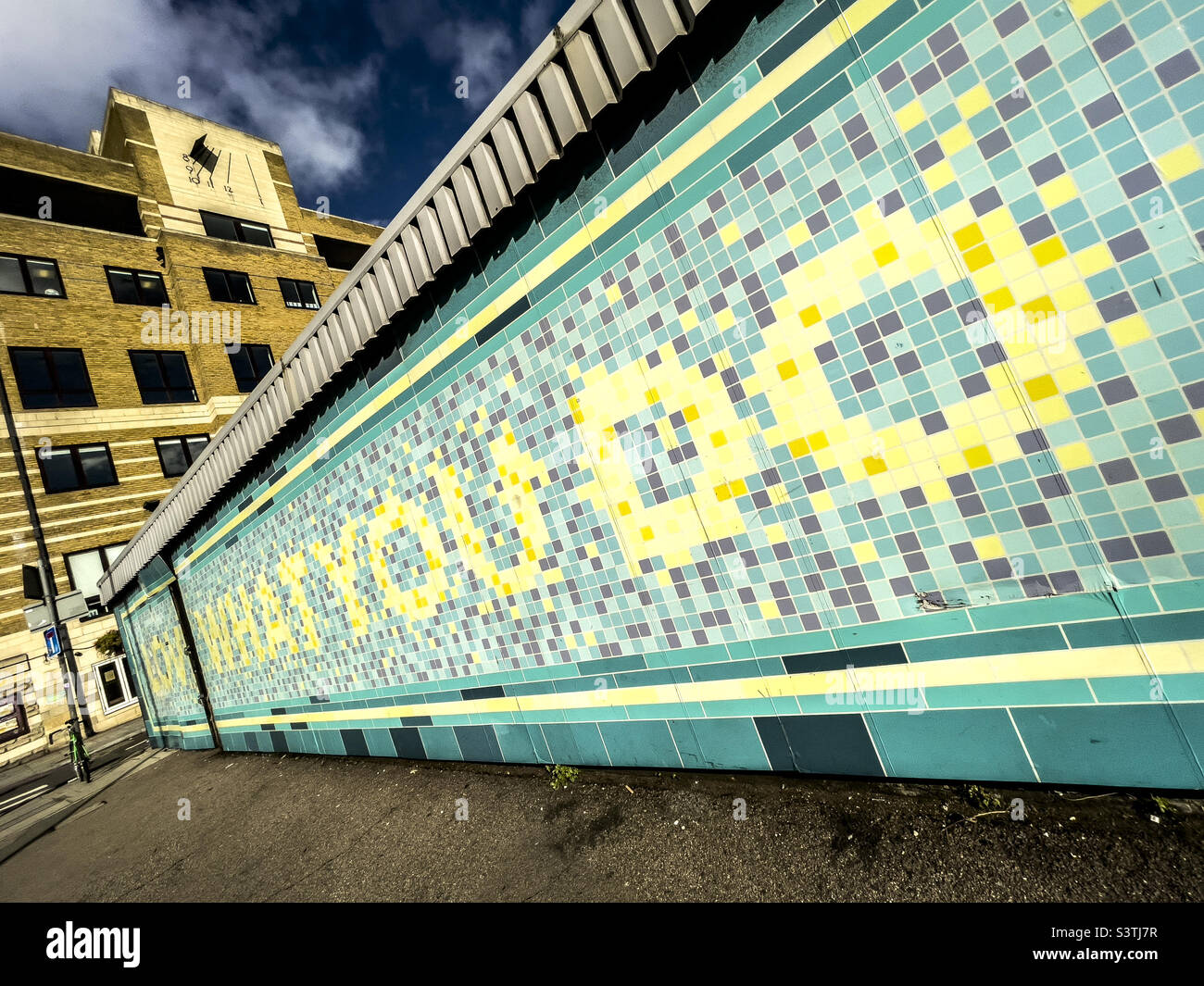 Inspirational tiled message "Love what you do" on the façade of the ...