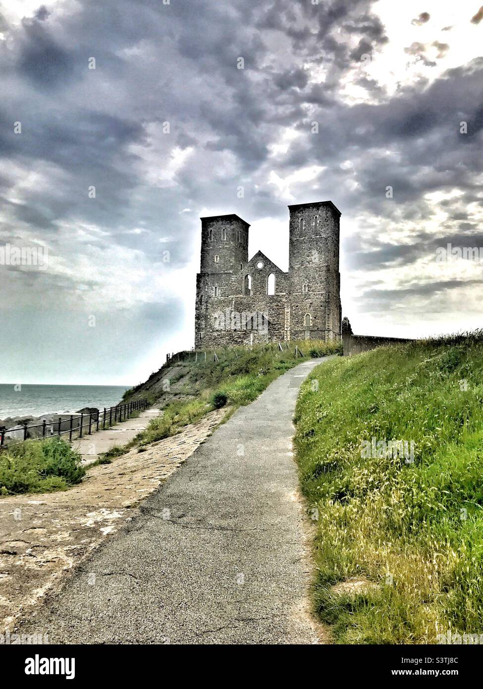 The imposing towers of the medieval church ruins at Reculver, Kent ...