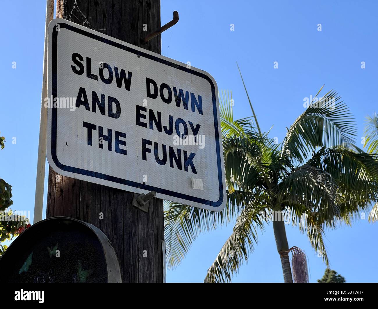 SANTA BARBARA, CA, NOV 2021: Street sign saying "Slow down and enjoy ...