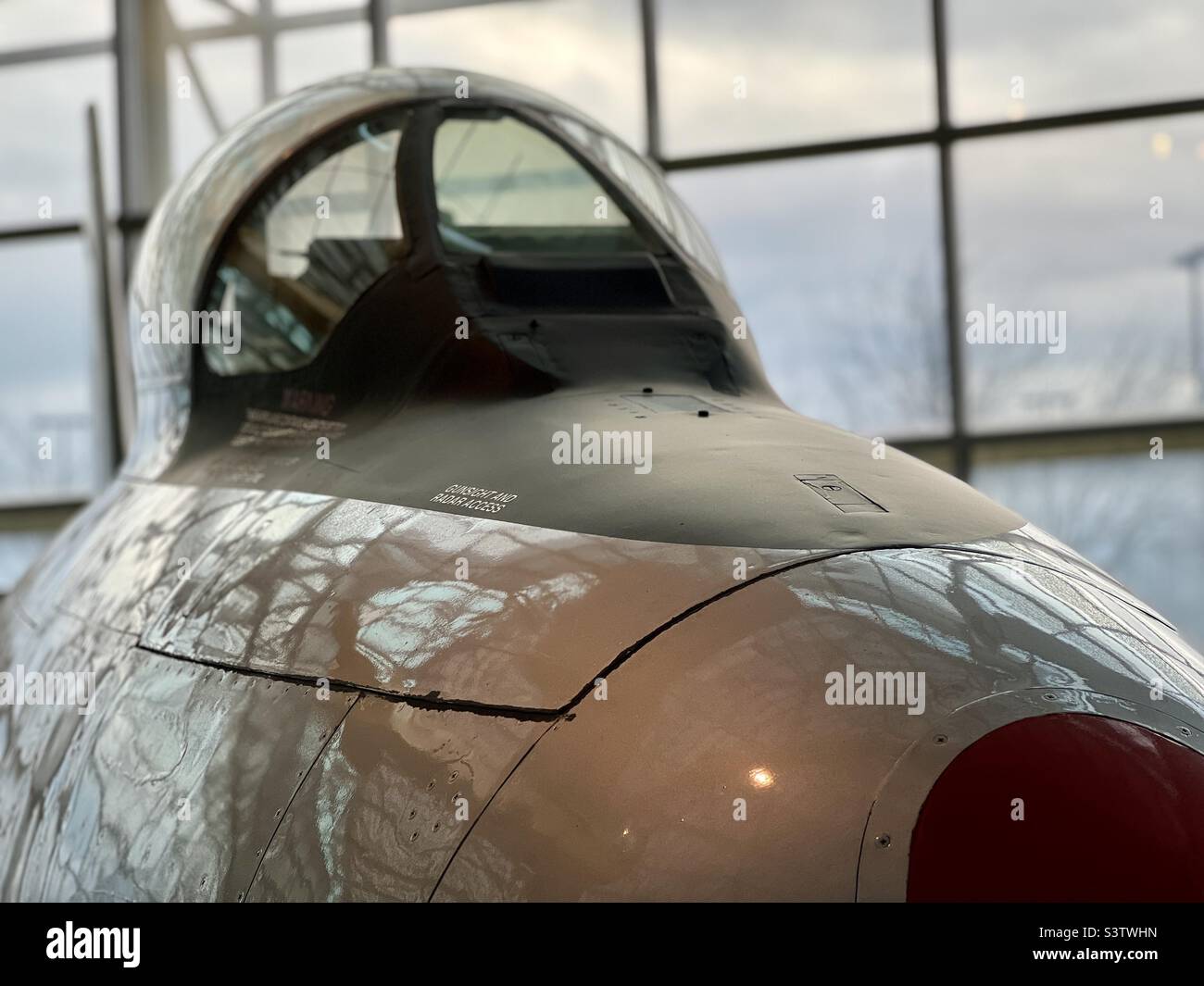 Shallow depth of field view of a jet fighter cockpit, with the words ...