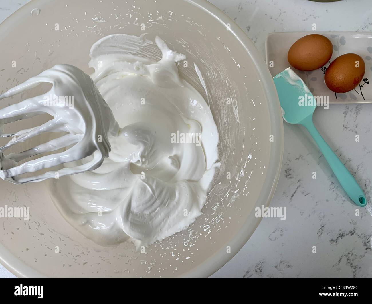 Whisking egg whites Stock Photo - Alamy