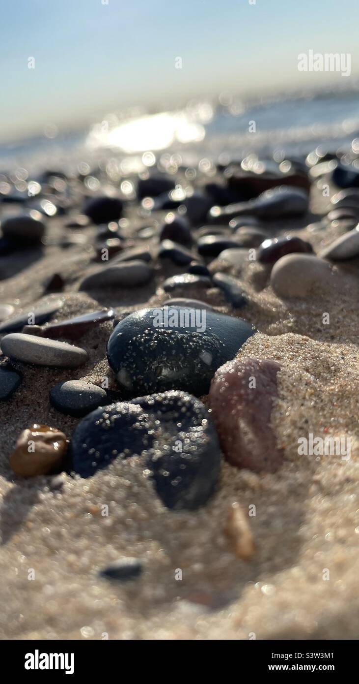 Rocks at sand beach hi-res stock photography and images - Alamy