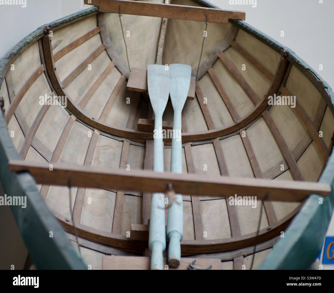 The hull or ribs of a classic dory with oars Stock Photo - Alamy