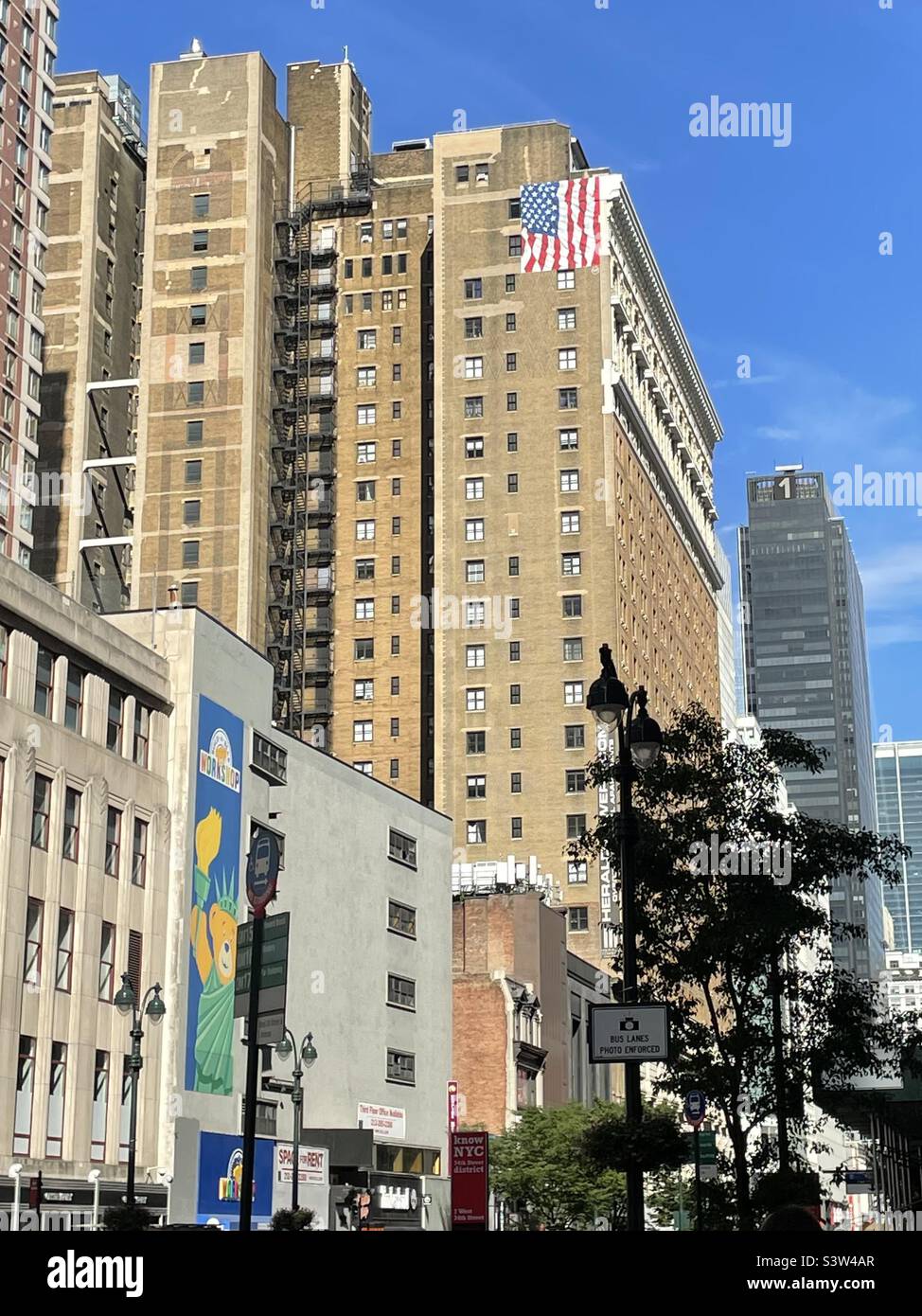 An American flag painted on the side of a skyscraper in New York City ...