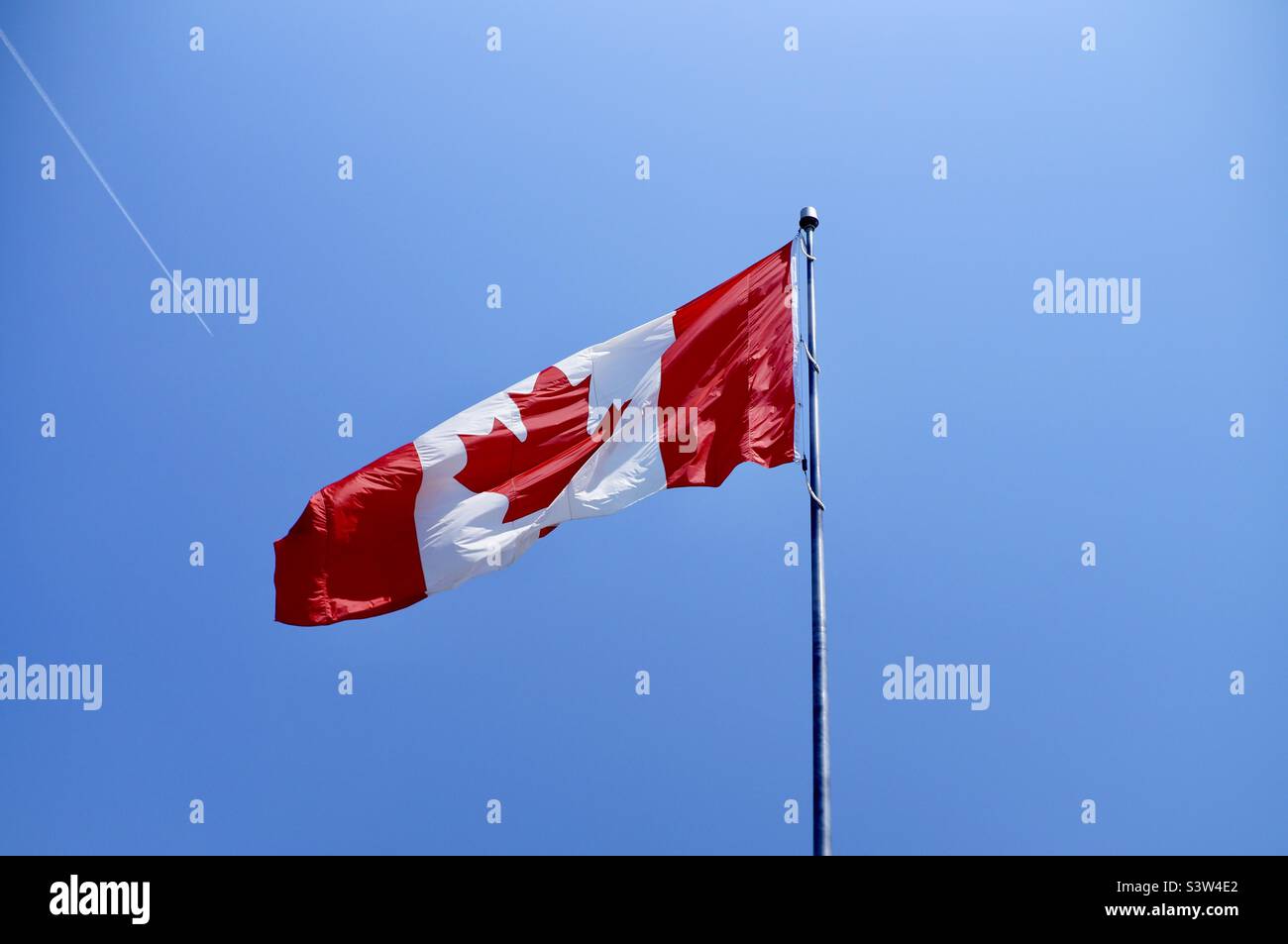 Huge Canadian flag in Halifax Harbour with a jet stream entering the ...