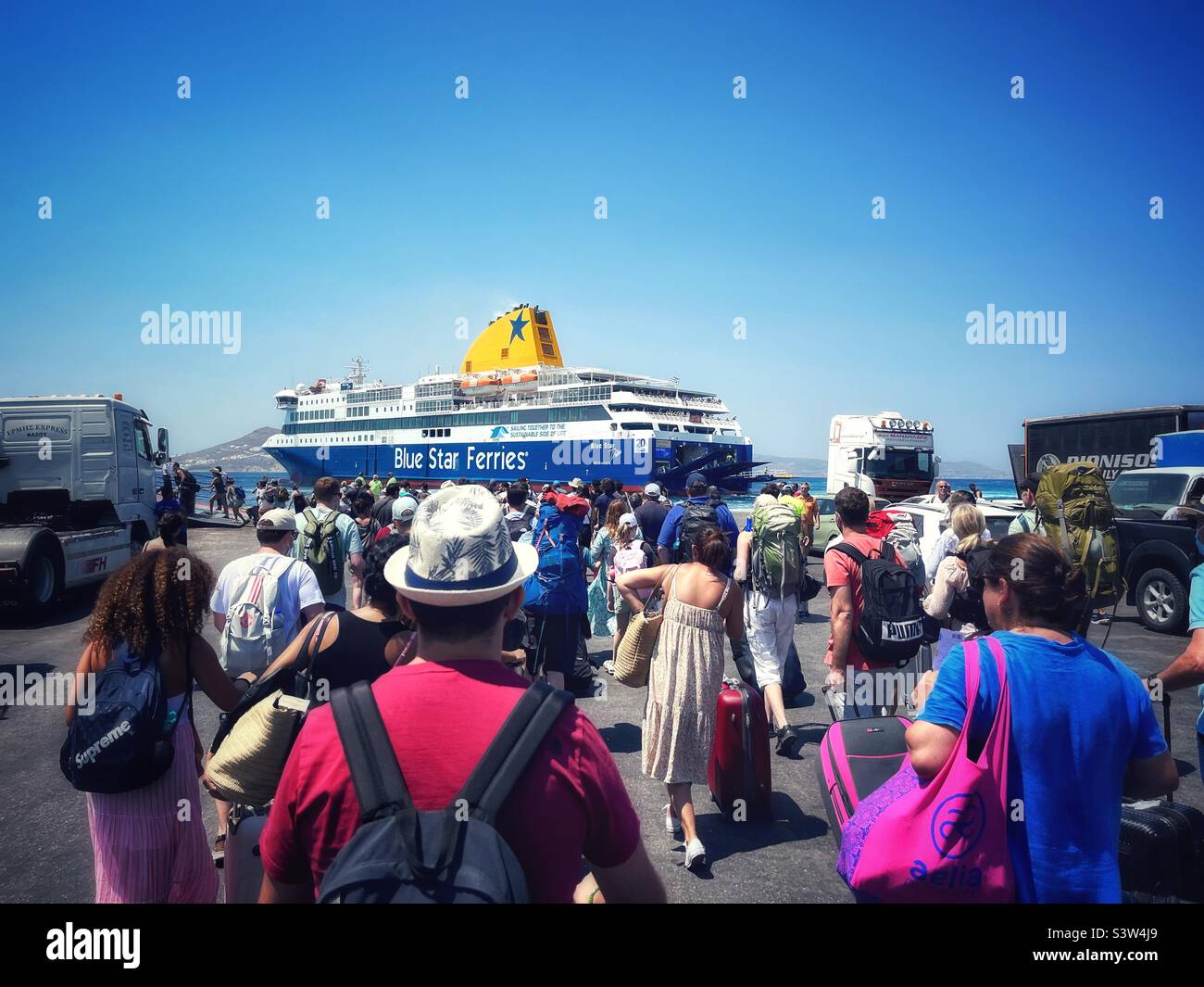 Passengers line up to board a ferry on the Greek island of Naxos Stock ...