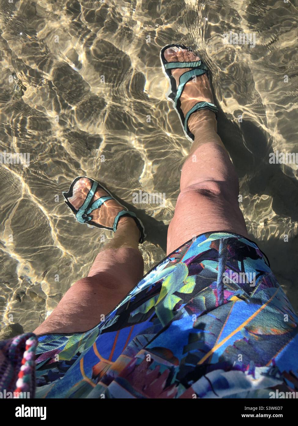 A woman standing in shallow water Stock Photo - Alamy