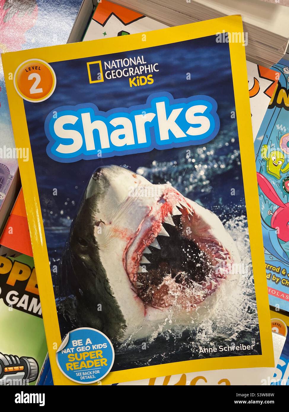 The National Geographic book “sharks” is for children, 2022, USA Stock ...