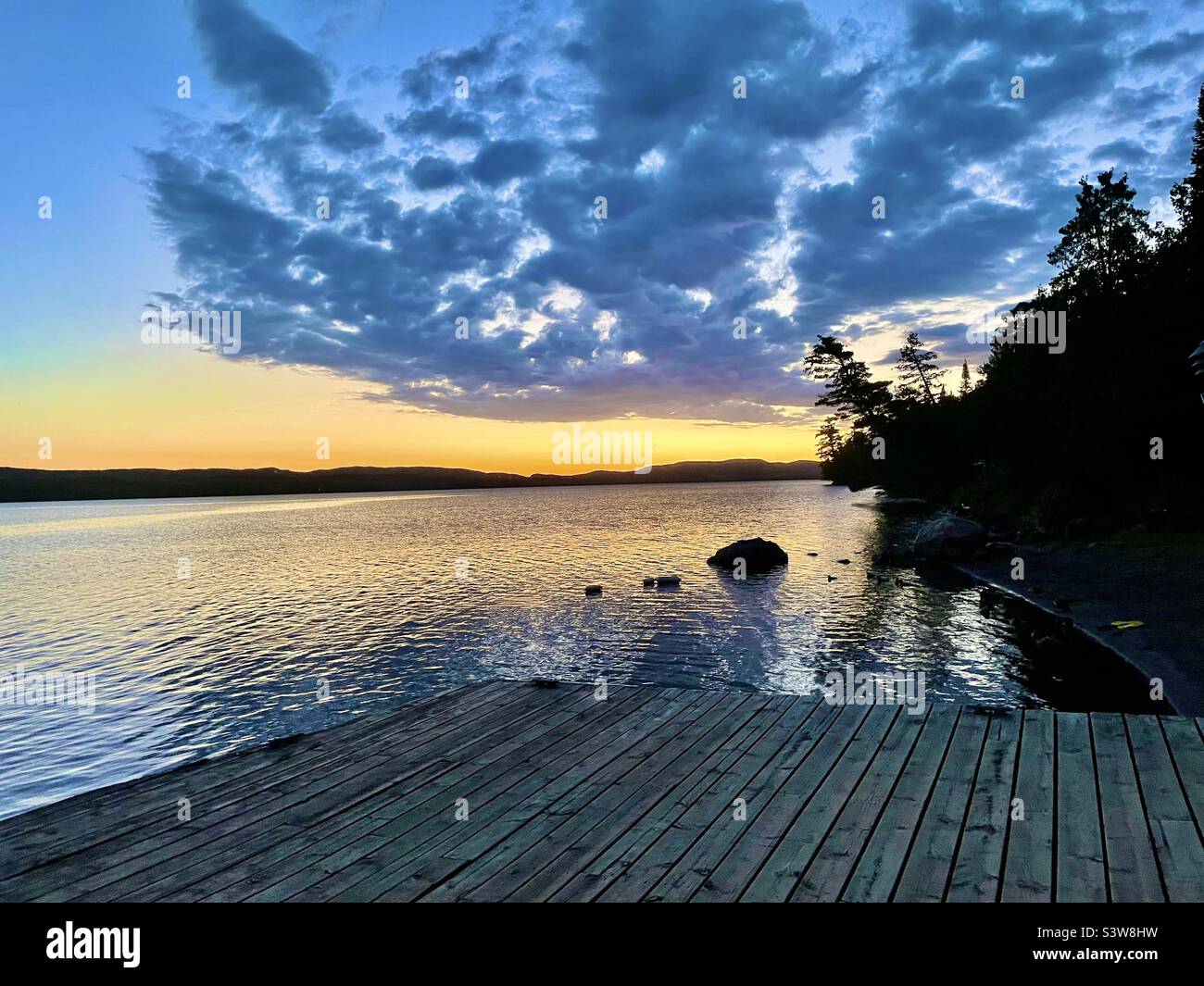 Sunrise over Gunflint lake Stock Photo - Alamy