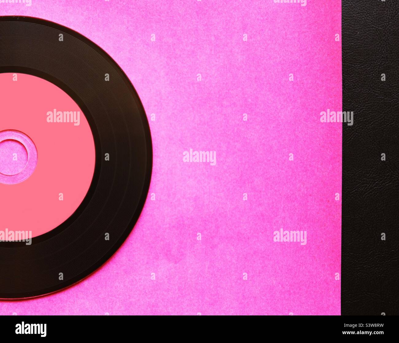 Pink vinyl disk in a pink background Stock Photo - Alamy