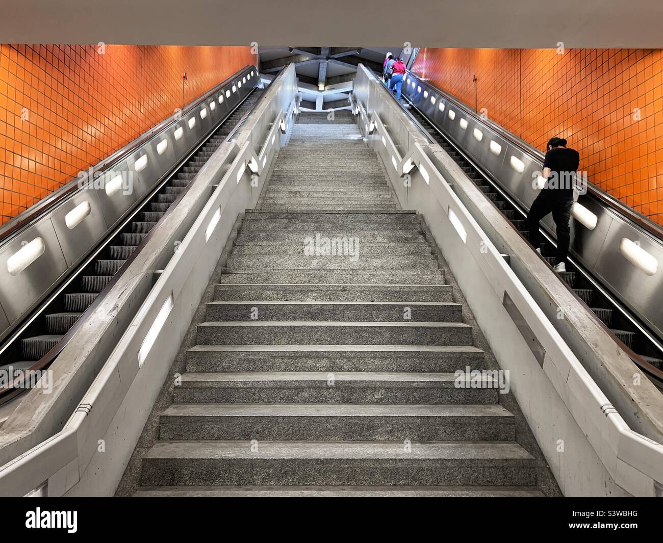 Stairs illuminated in orange colors Stock Photo - Alamy