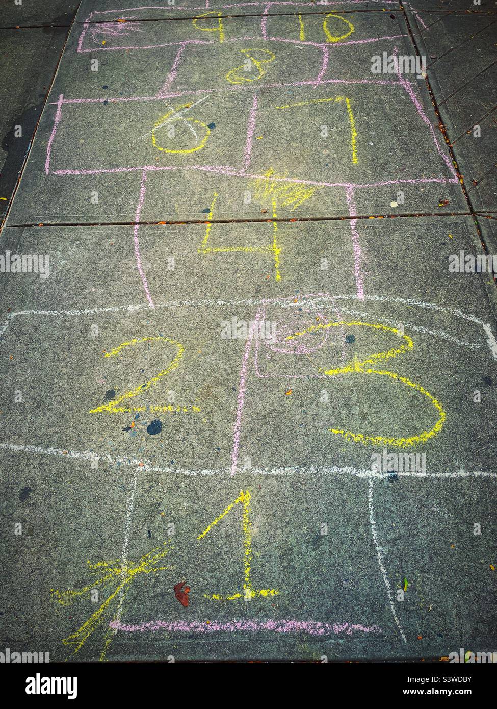 Hopscotch squares drawn in chalk on a New York City sidewalk, 2022, USA ...