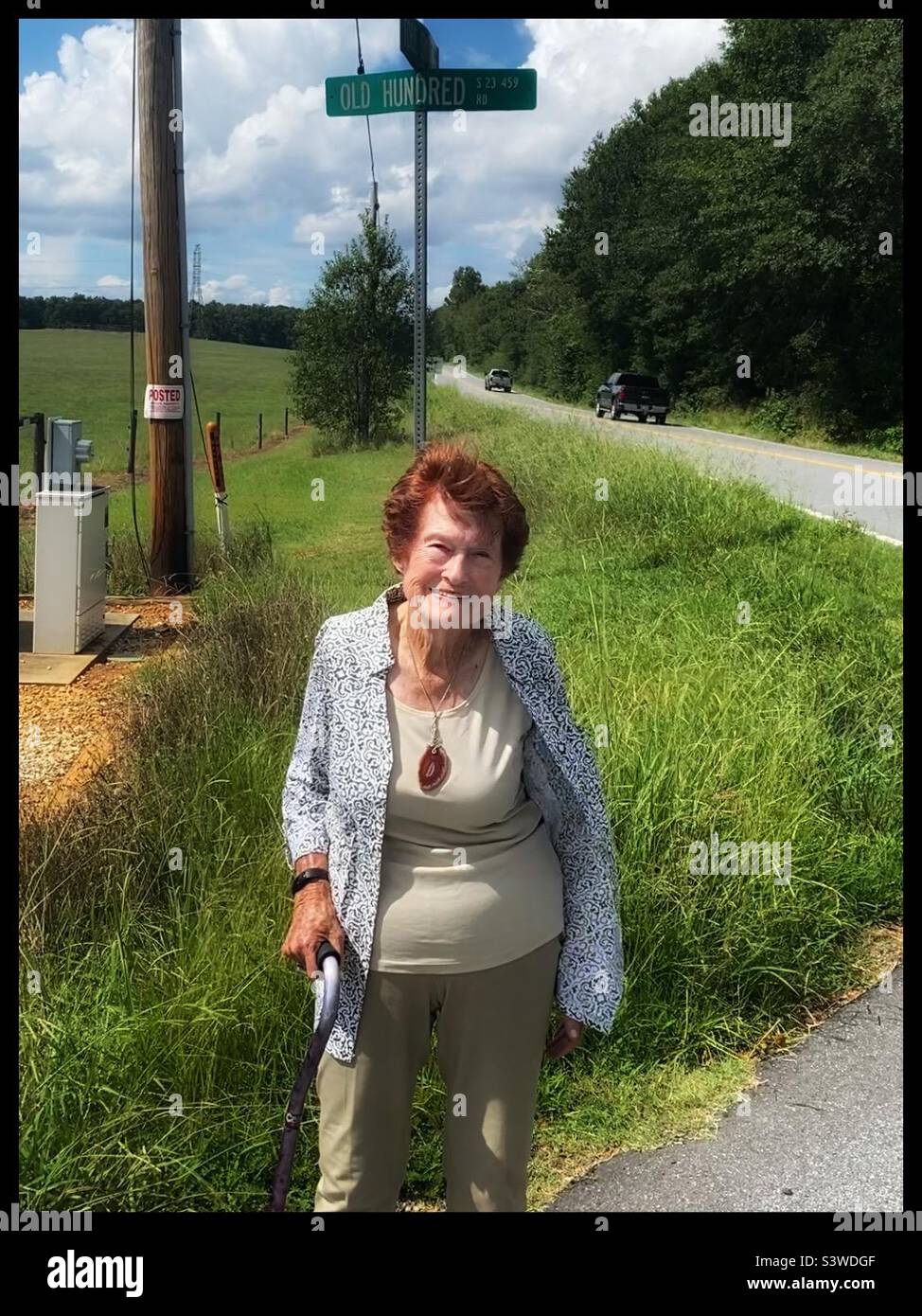 101 year old beautiful lady in front of road sign that reads old one ...