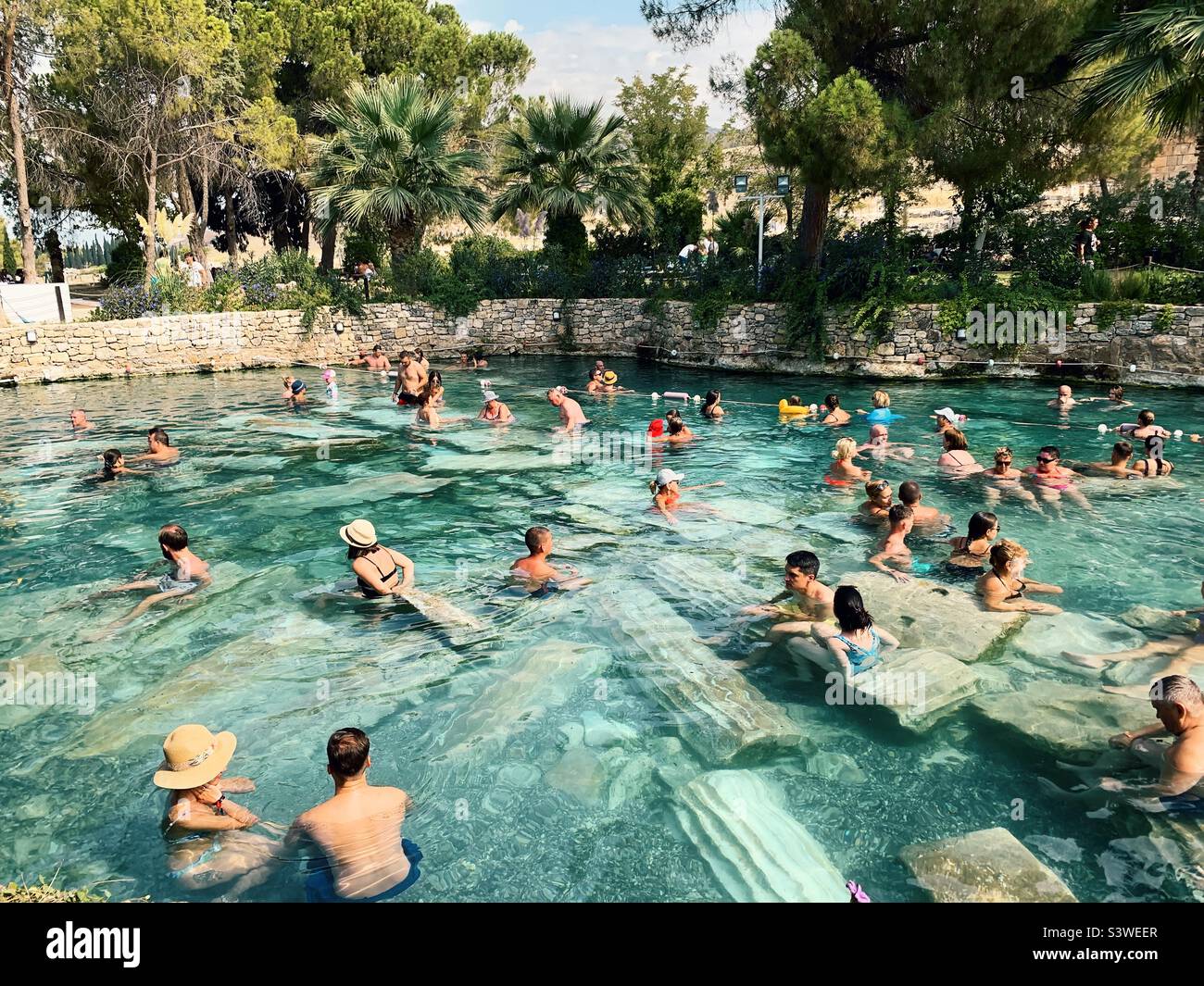 People swimming in the pool with ancient columns Stock Photo - Alamy