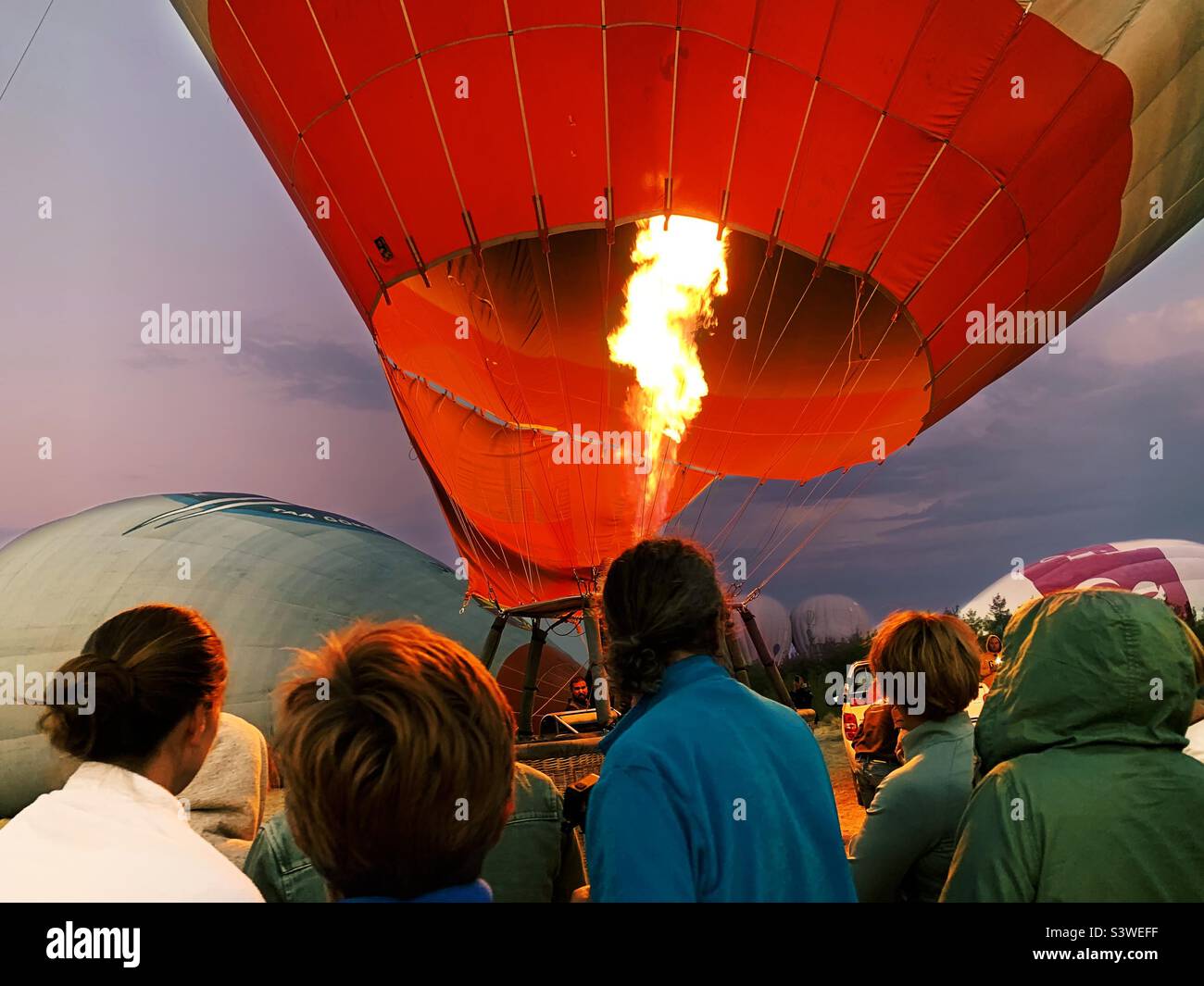 Hot air balloon filling with fire Stock Photo - Alamy