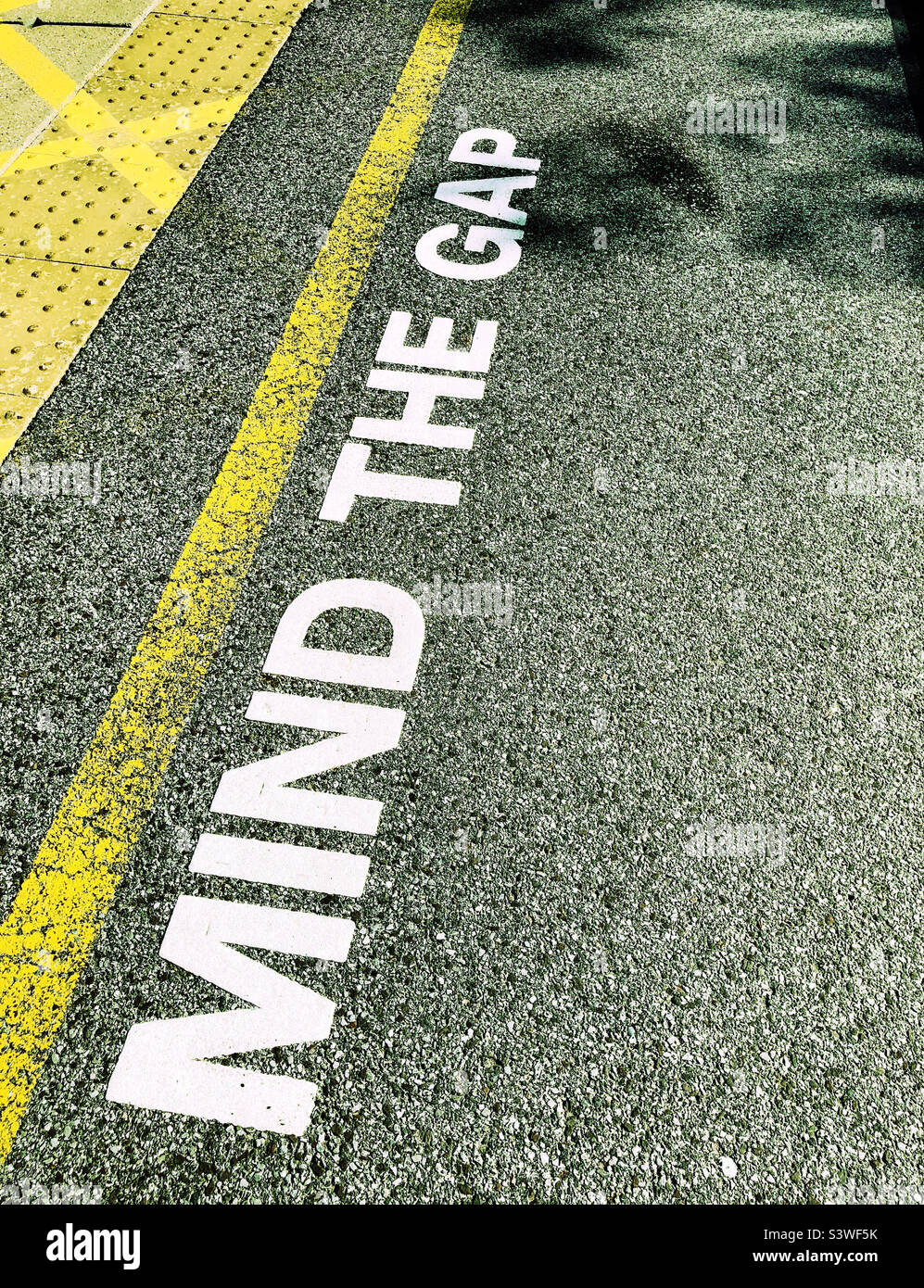 Mind the gap safety message on a railway platform in England, United ...
