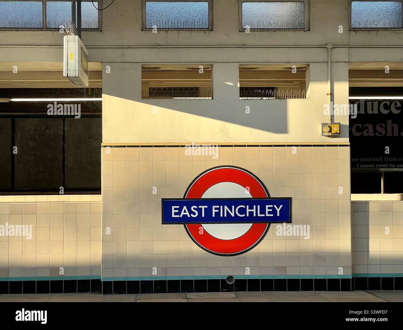 London Underground East Finchley station platform Roundel sunlit Stock ...