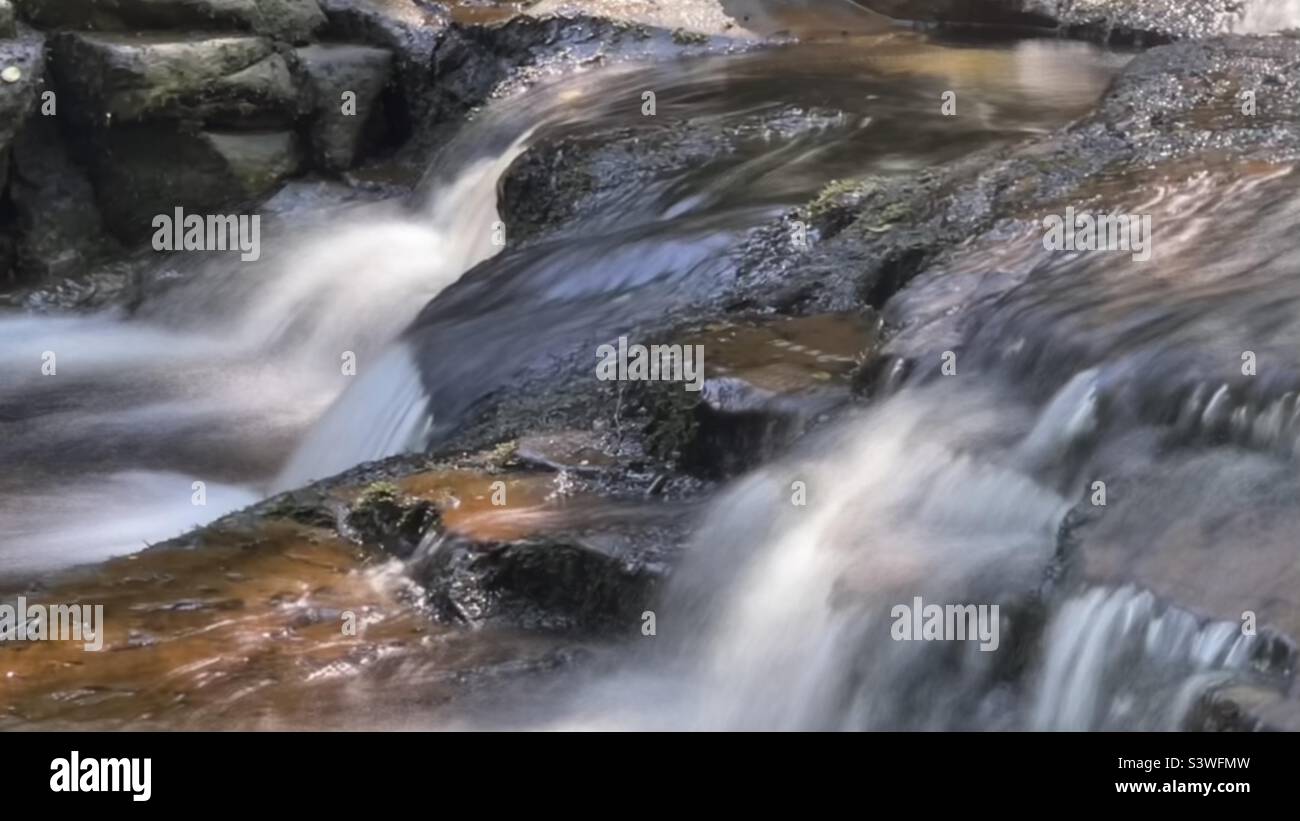Water running over rocks hi-res stock photography and images - Alamy