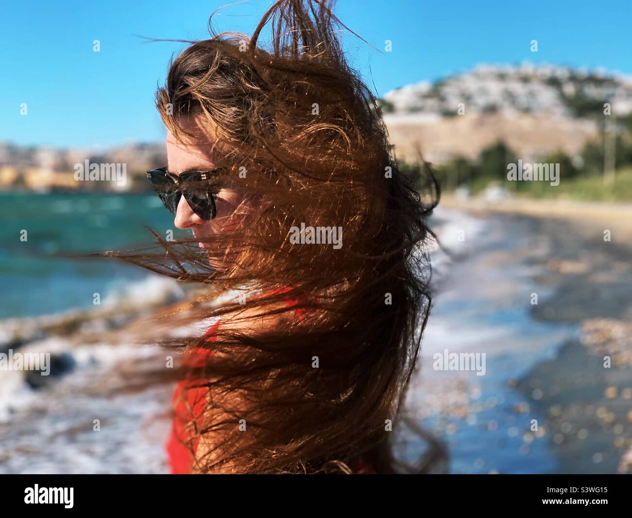 Wind in long hair Stock Photo - Alamy