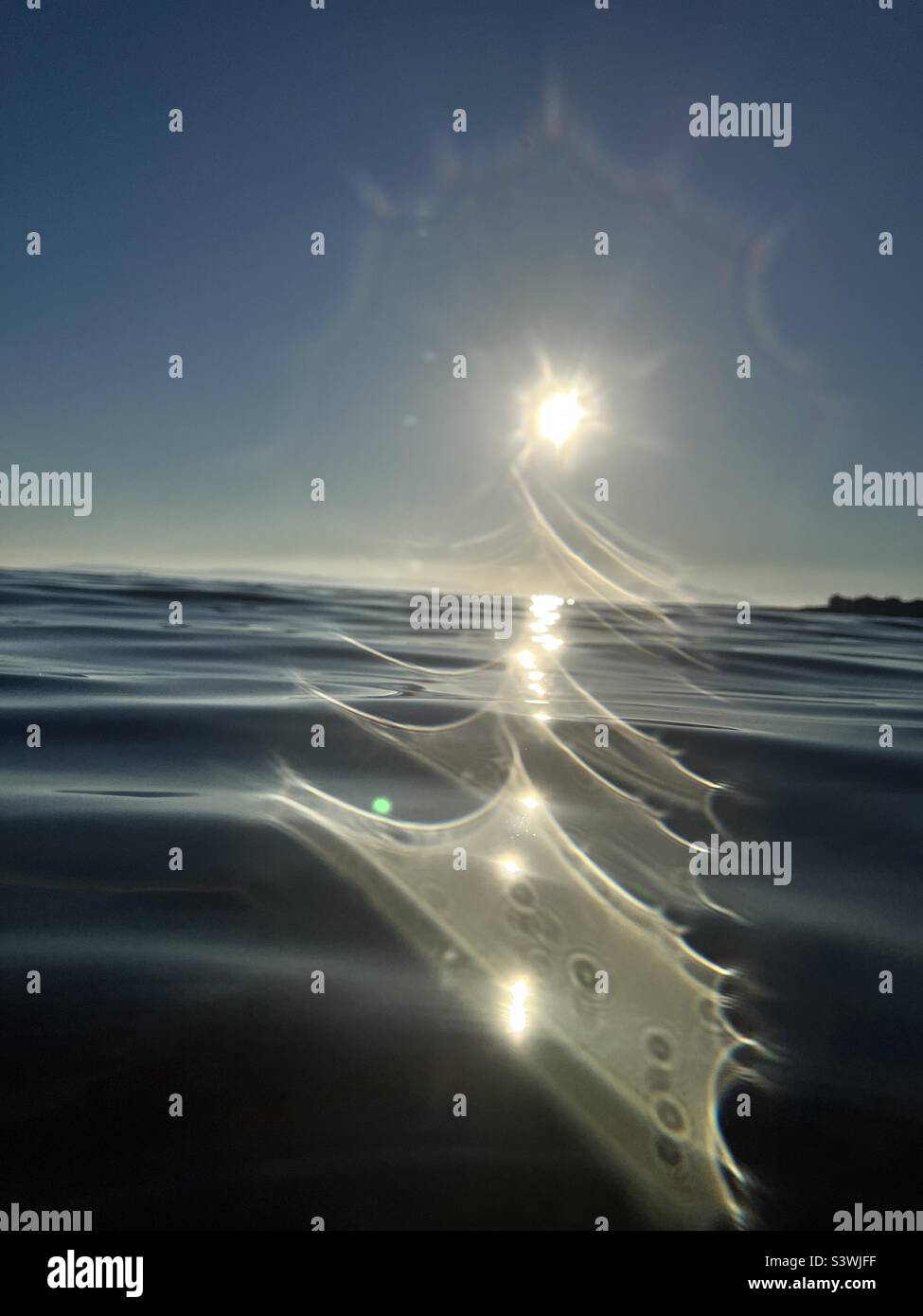 Troon Beach in the Sunset with water splash Stock Photo - Alamy