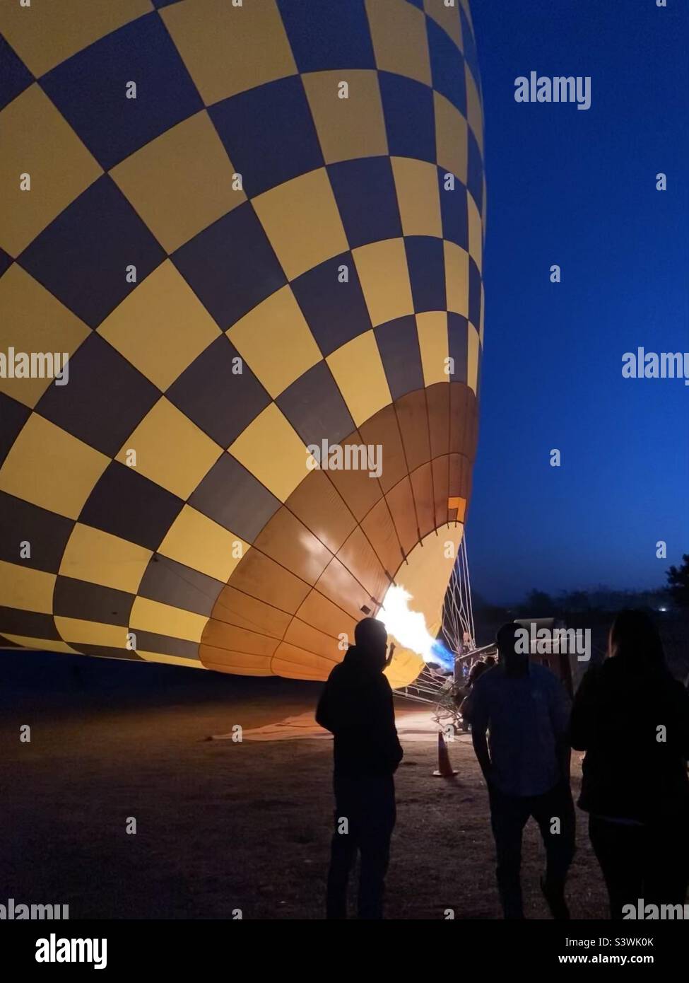 Hot air Ballon getting inflated in the night Stock Photo - Alamy