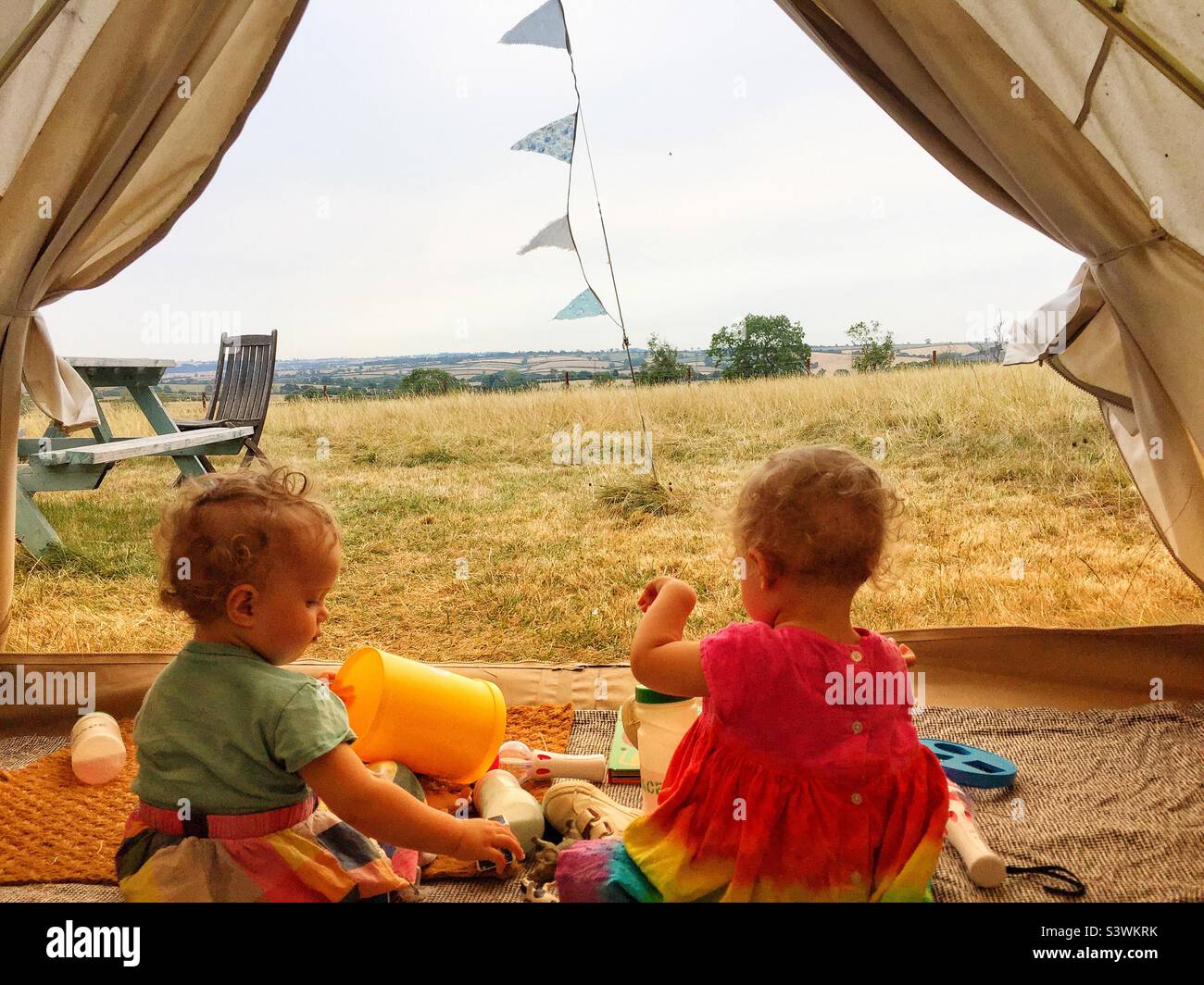 Teepee camping with twins Stock Photo - Alamy