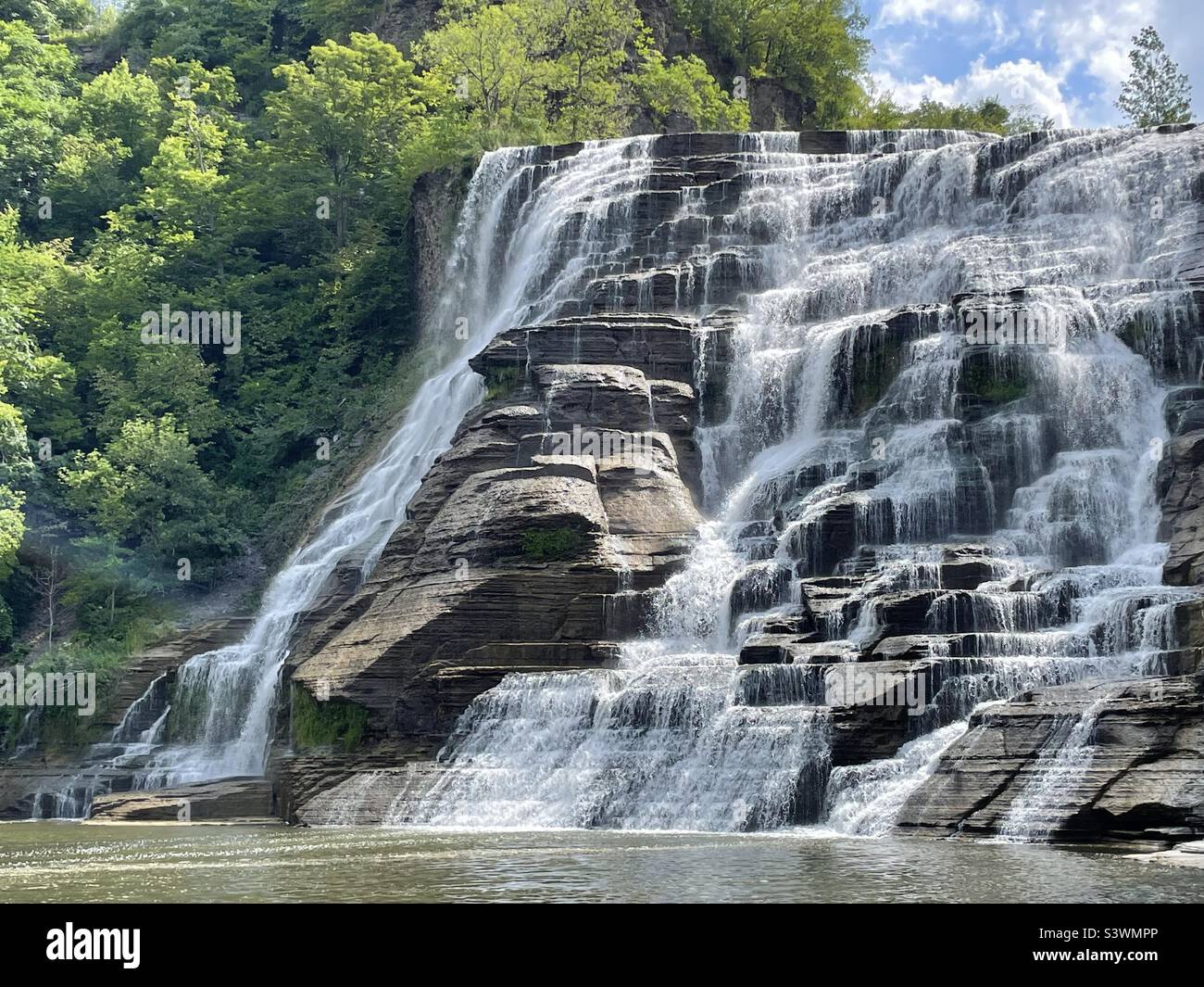 Fall Creek cascades over Ithaca Falls on its way to Cayuga Lake in New ...