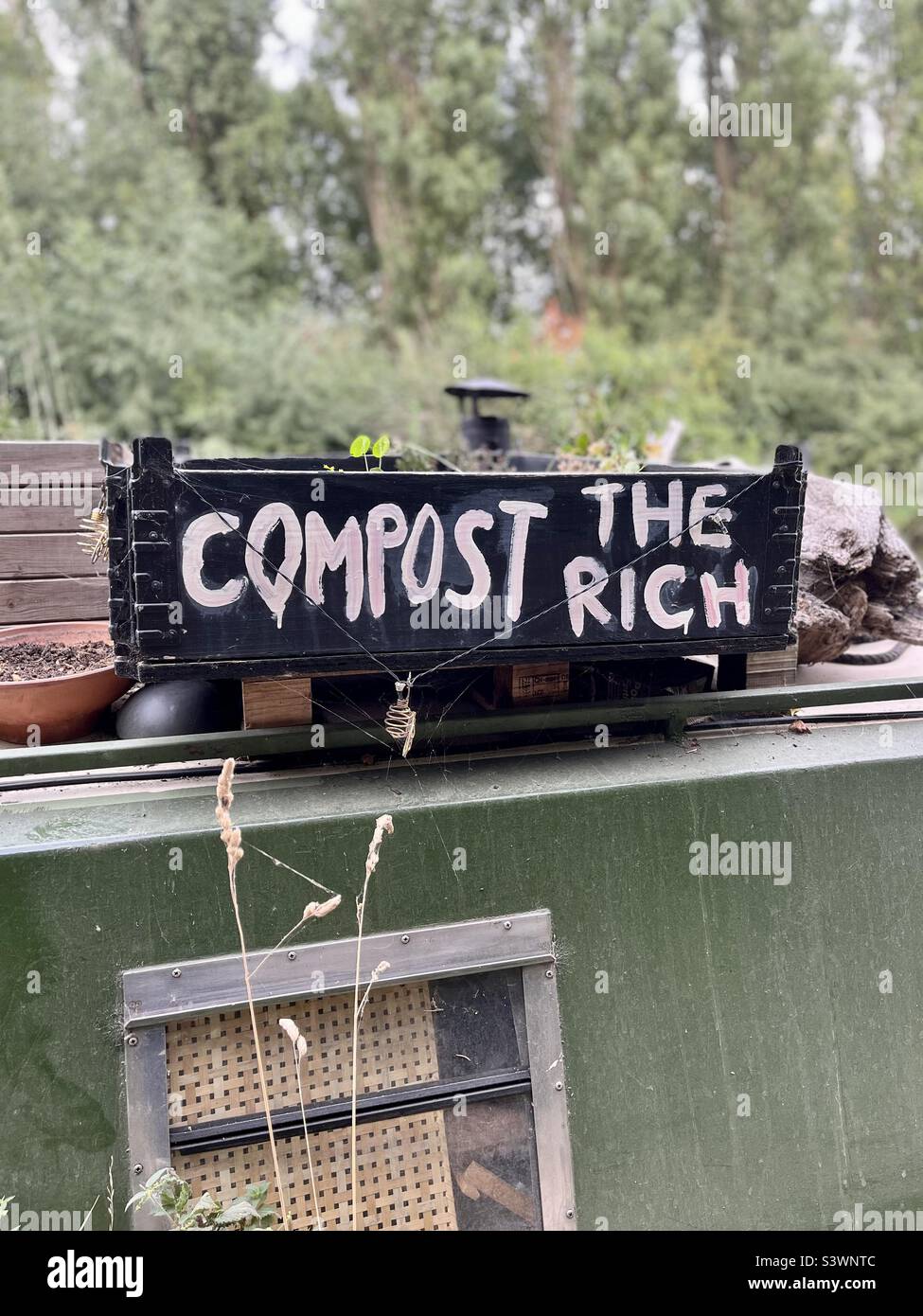 Compost the rich sign on a narrow boat on the River Lee, Essex Stock ...