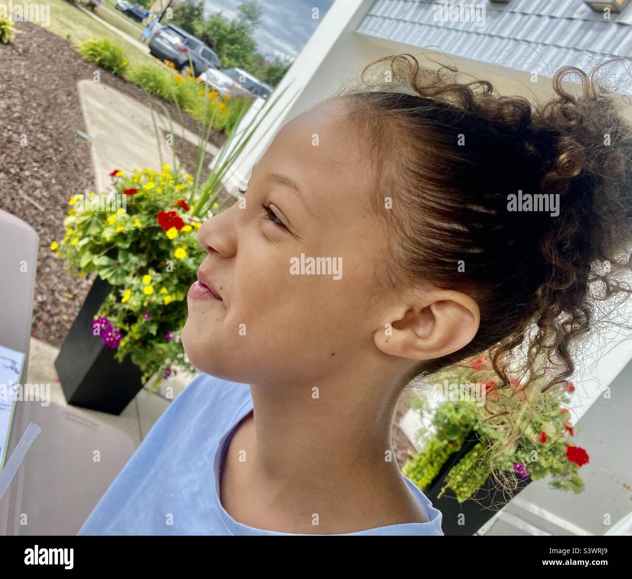 Smiling girl side view Stock Photo - Alamy