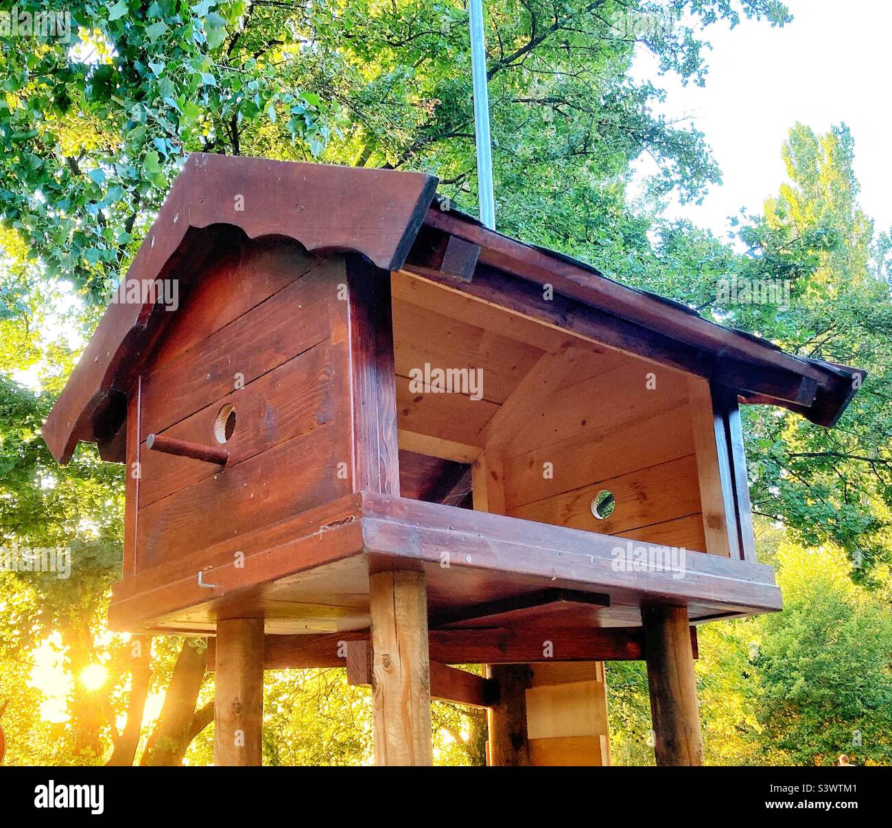 Big wooden bird feeder Stock Photo - Alamy