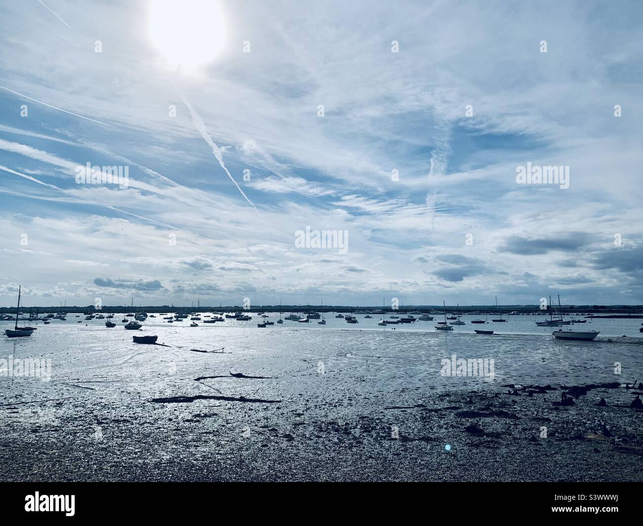 Blue sky and clouds at Mersea beach in Essex Stock Photo - Alamy