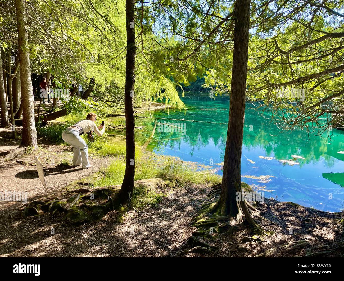 Woman photographing Big Spring Stock Photo - Alamy