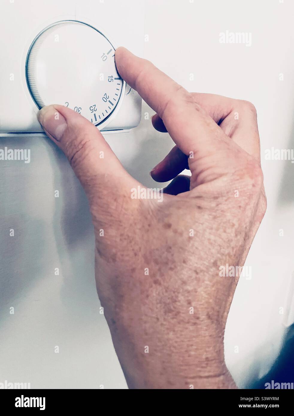 Turning the heating off. Fuel cost rise worries Stock Photo - Alamy