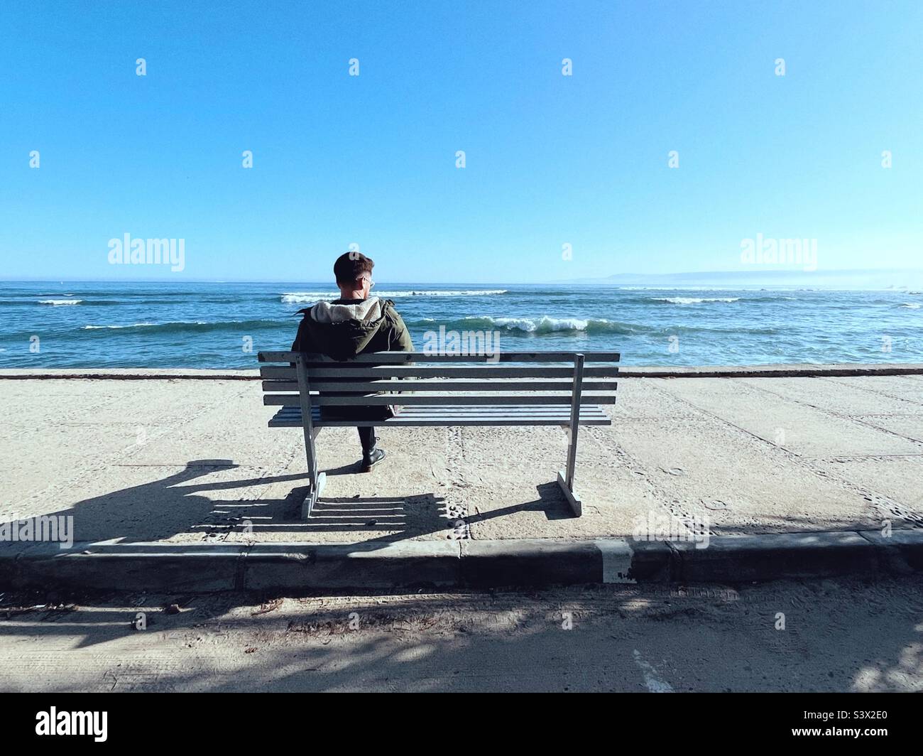Man sitting on the bench Stock Photo - Alamy