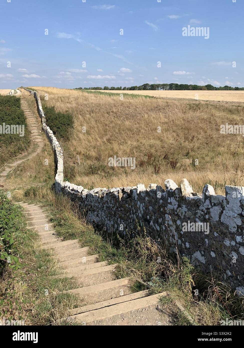 Steps and crooked wall following coastal walk Stock Photo - Alamy
