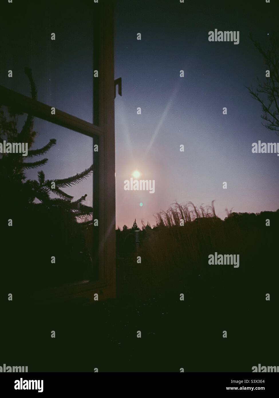 Moon out the window Stock Photo - Alamy