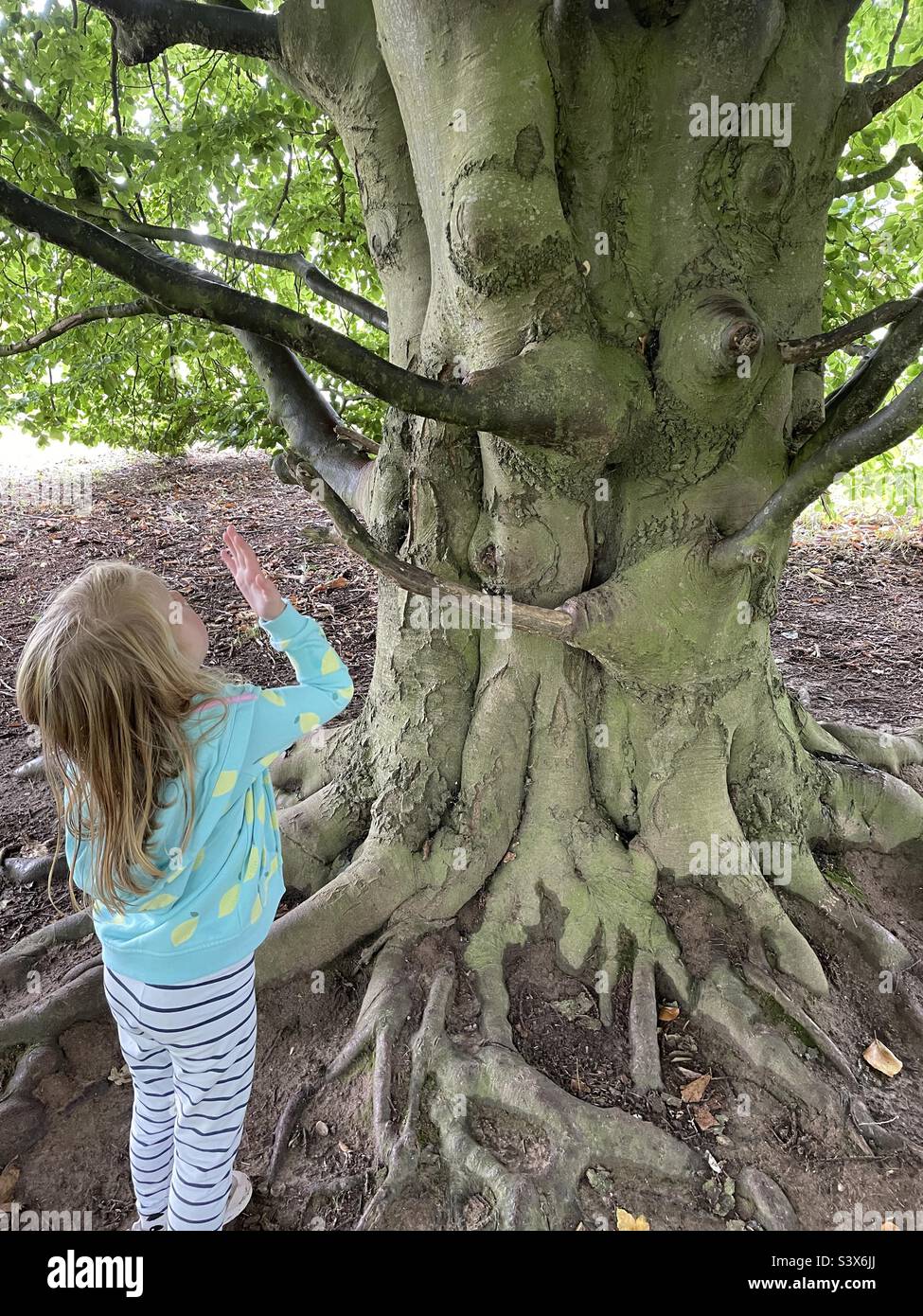 Tree with girl hi-res stock photography and images - Alamy