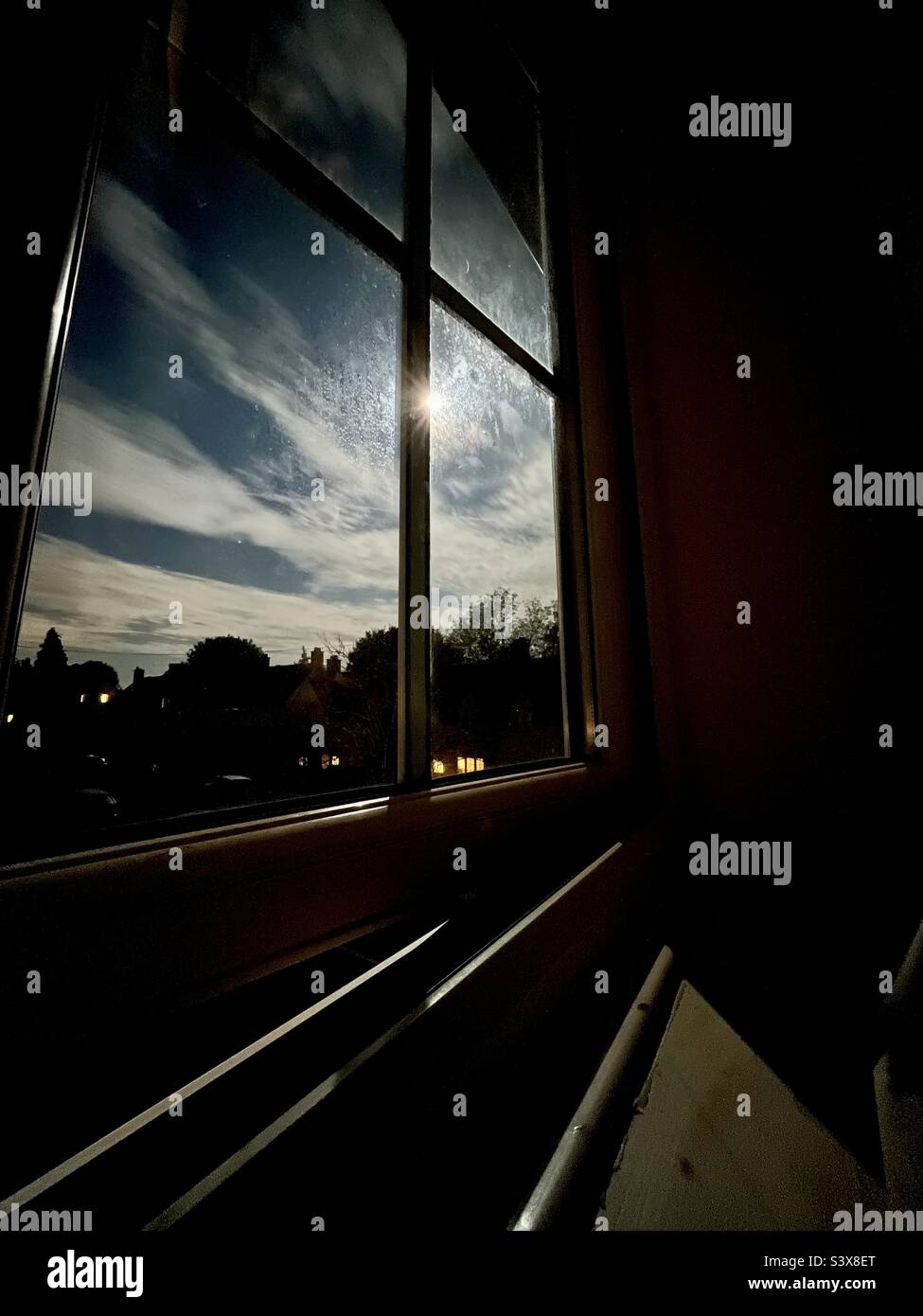 The moon shining through the window Stock Photo - Alamy