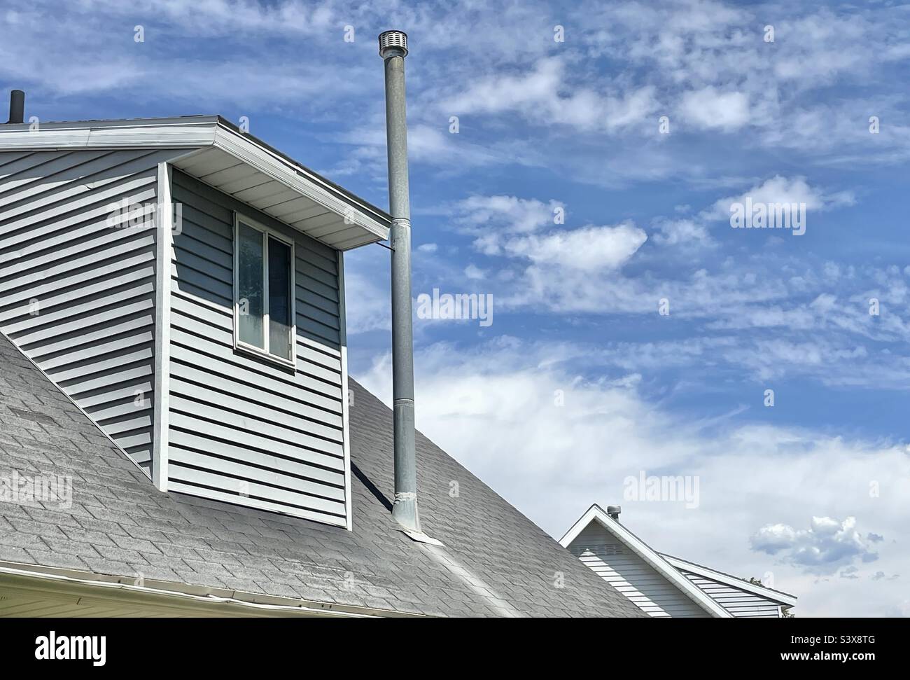 A Cape Cod styled home (built in the mid- 1980s) from the back, looking ...