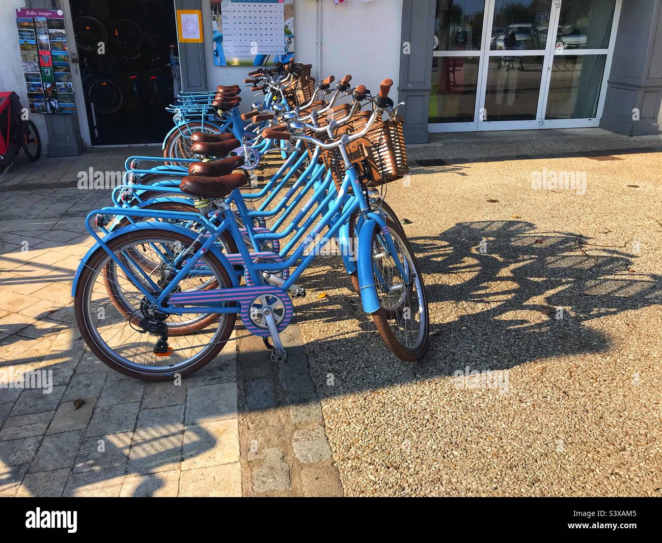 blue bicycles in a square in France Stock Photo - Alamy