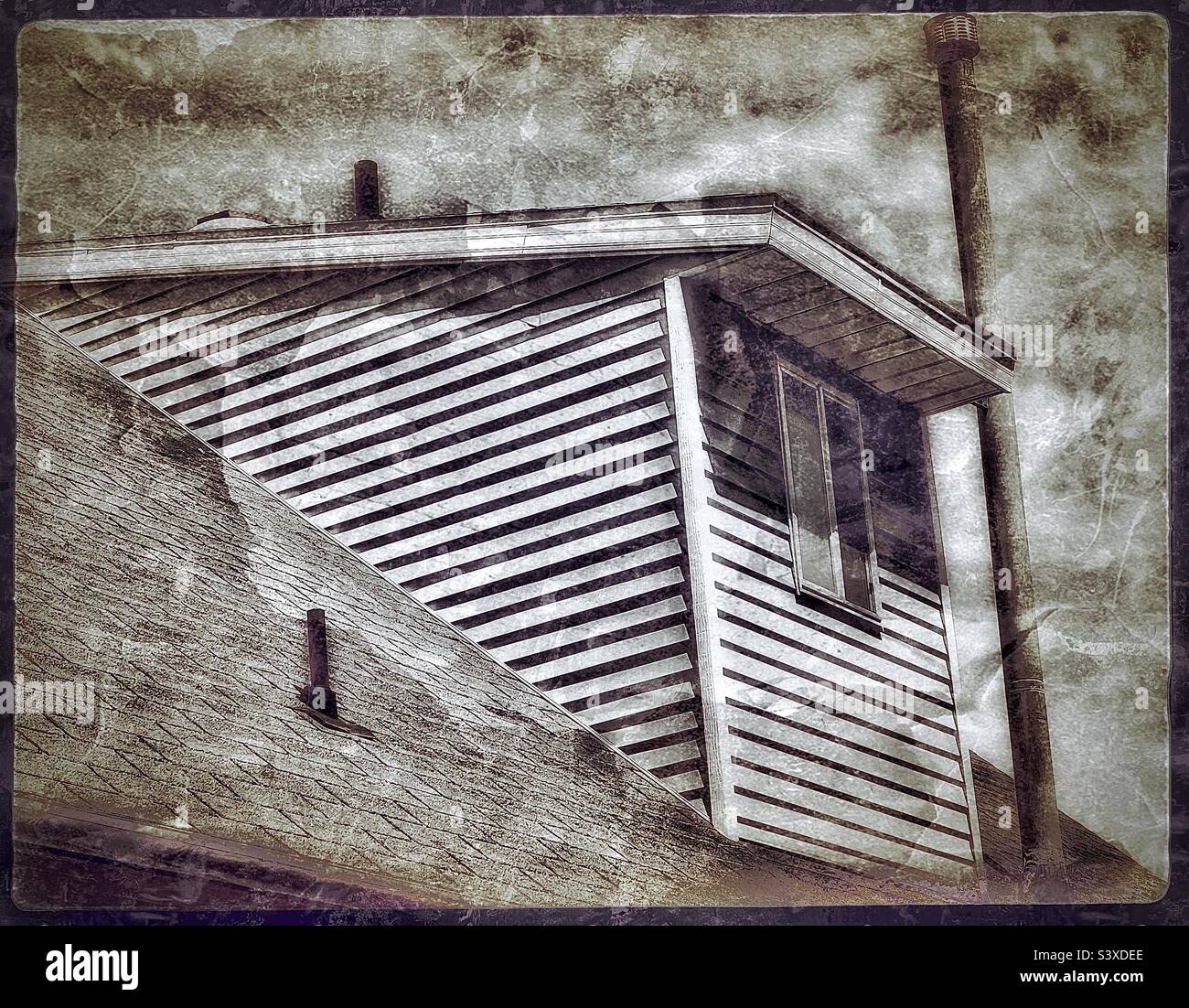 Showing the back rooftop area of a Cape Cod style home with a 2nd story ...