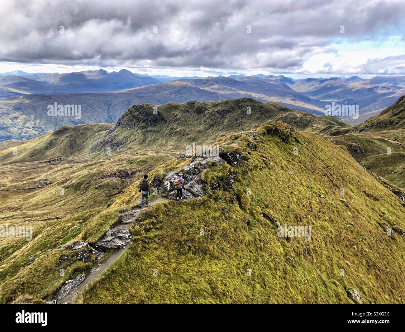 Walkers on the path of the Tarmachan ridge, Killin, Scotland Stock ...