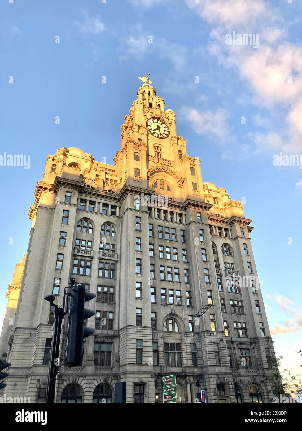 Sun rising over the Liver Buildings Liverpool Stock Photo - Alamy