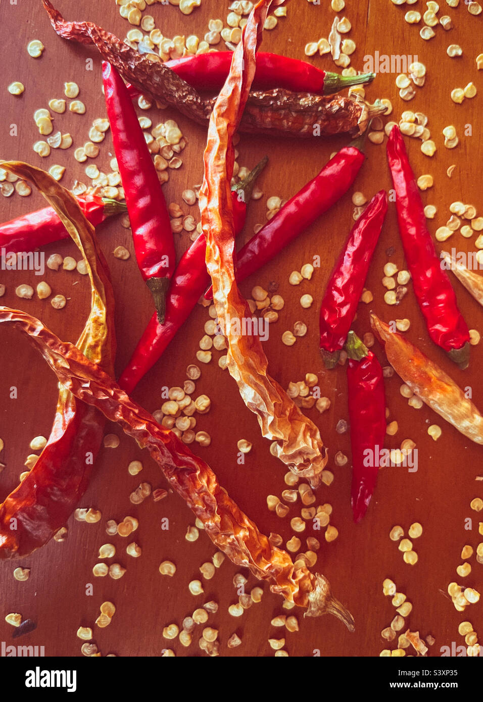 Fresh chilli, dried chilli, chilli seeds on wood Stock Photo - Alamy