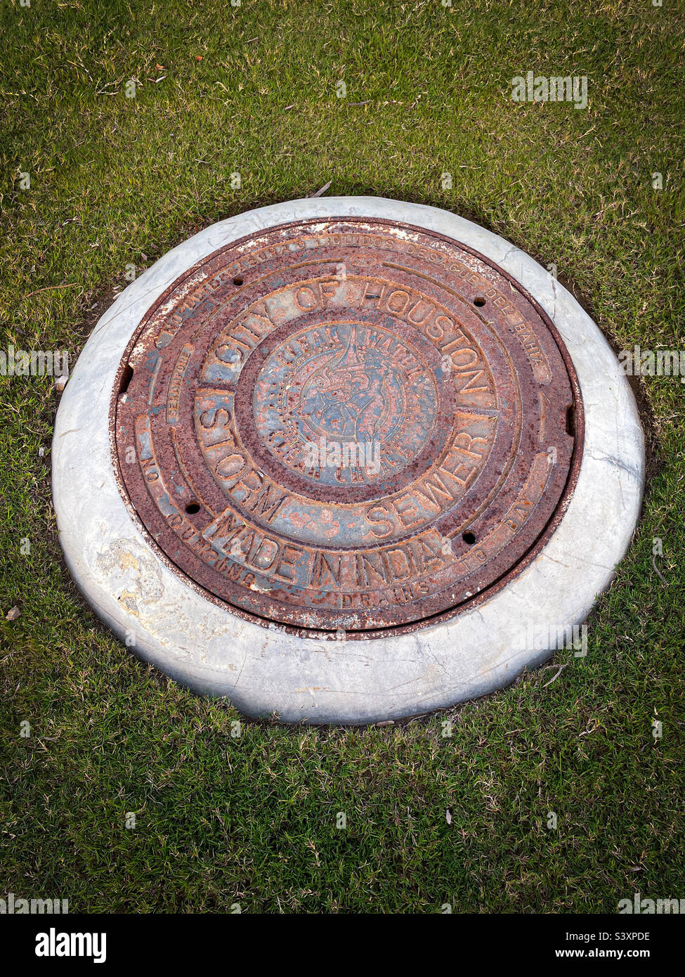 City of Houston rusty sewer storm manhole cover Stock Photo - Alamy