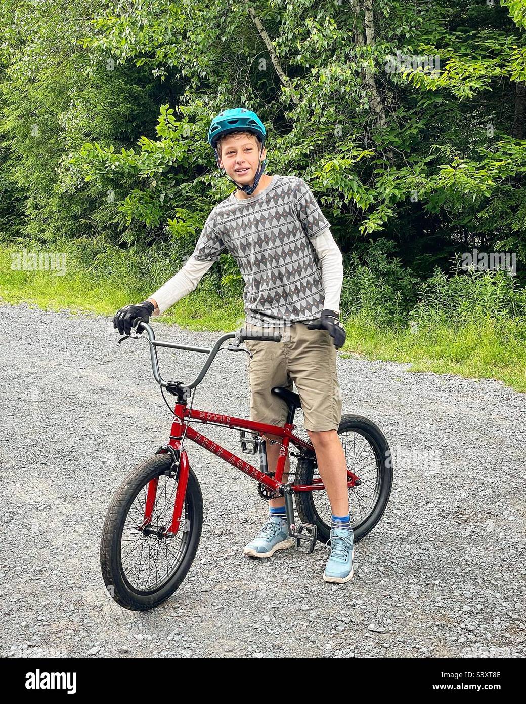 Boy with a bike Stock Photo - Alamy