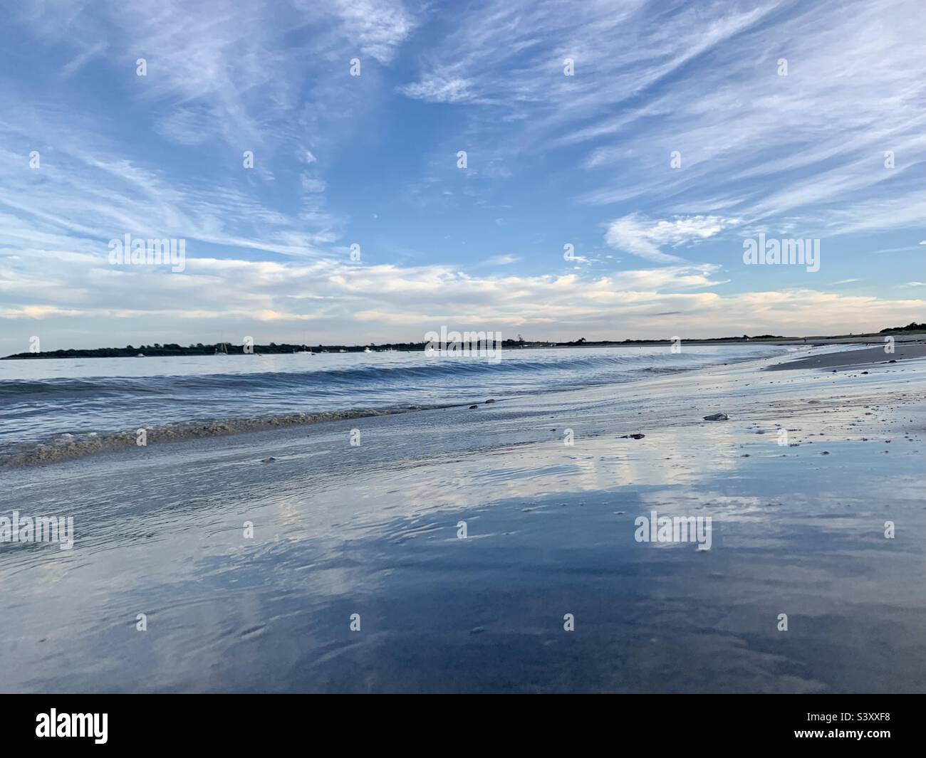 Dramatic ocean reflection of the sky with clouds Stock Photo - Alamy