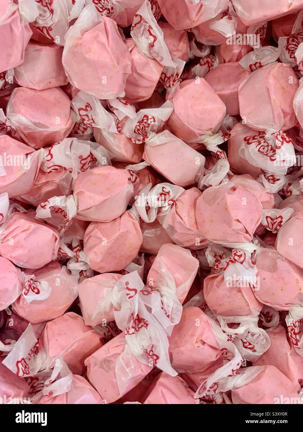 Pink taffy candies Stock Photo - Alamy
