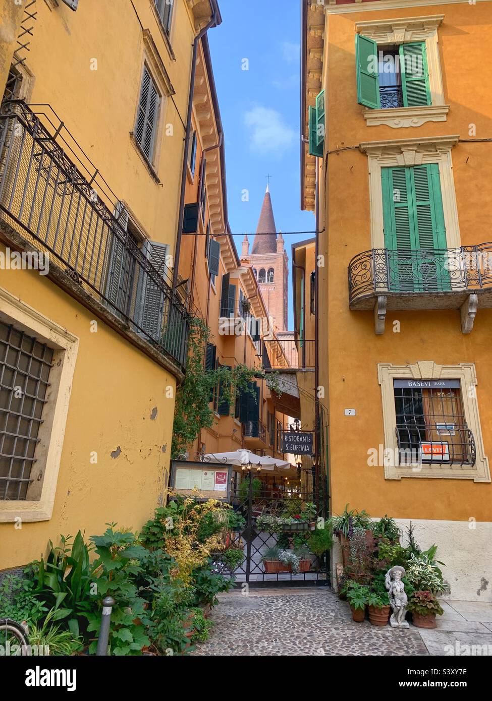 Yellow houses Verona street scene Italy Stock Photo - Alamy